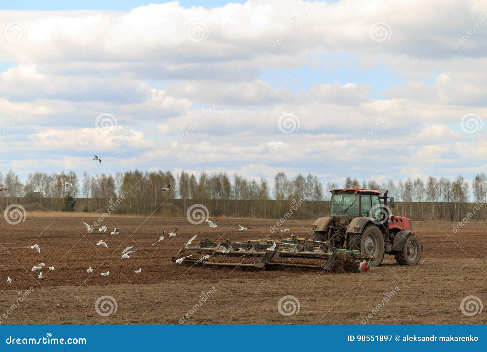 The Tractor Plows the Field in the Spring Editorial Photography - Image ...