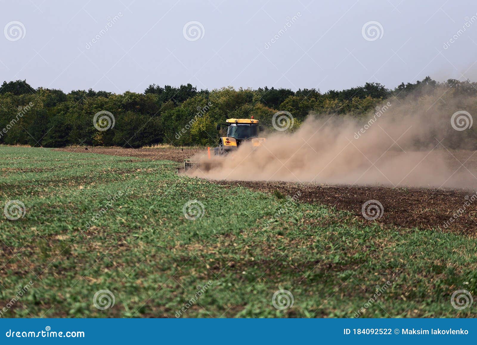 Tractor Plows the Field in the Spring. Stock Photo - Image of landscape ...