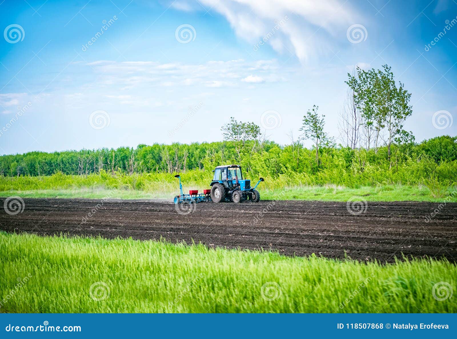 Tractor Plows the Land in the Field in the Spring Stock Photo - Image ...