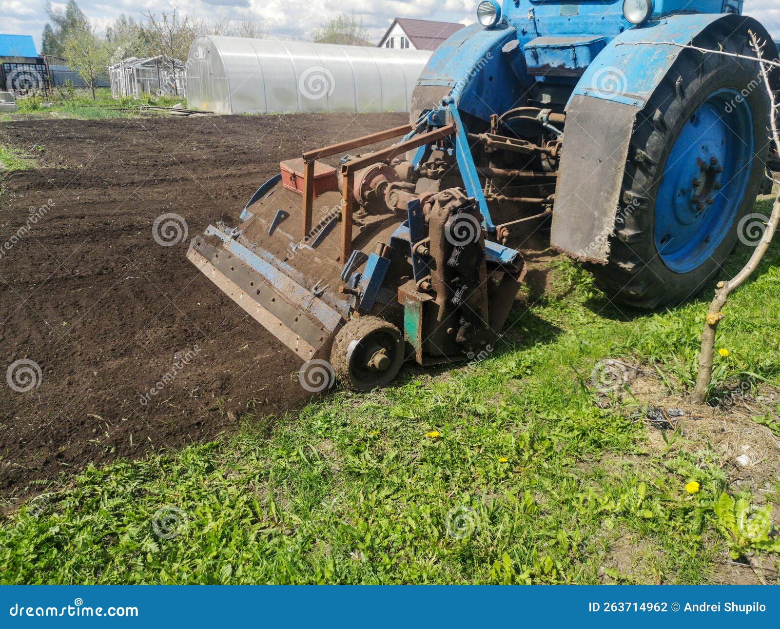 The Tractor Plows the Soil on the Field Stock Photo - Image of plowed ...