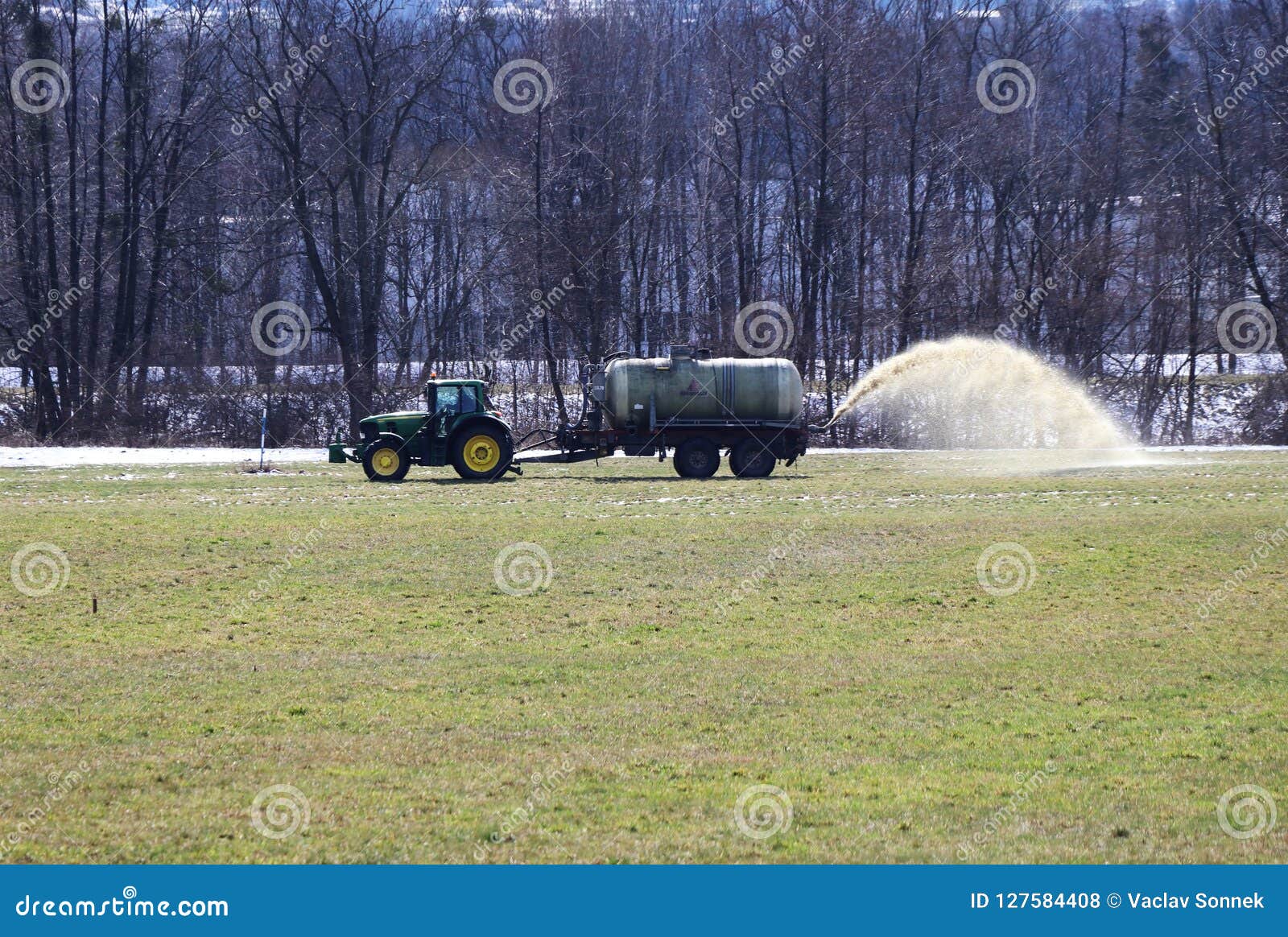 A Tractor Pouring the Field with Liquid Manure for Better Structure of ...