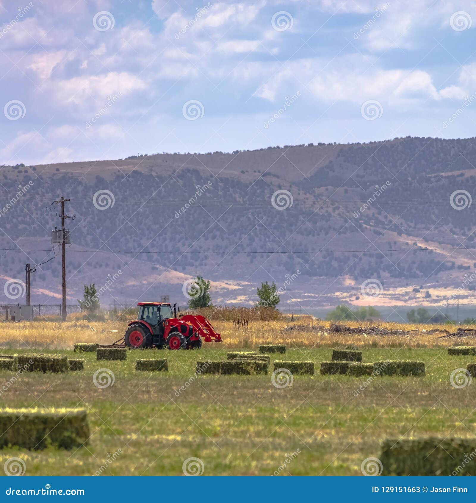 Tractor and Power Lines on a Field in Utah Valley Stock Image - Image ...