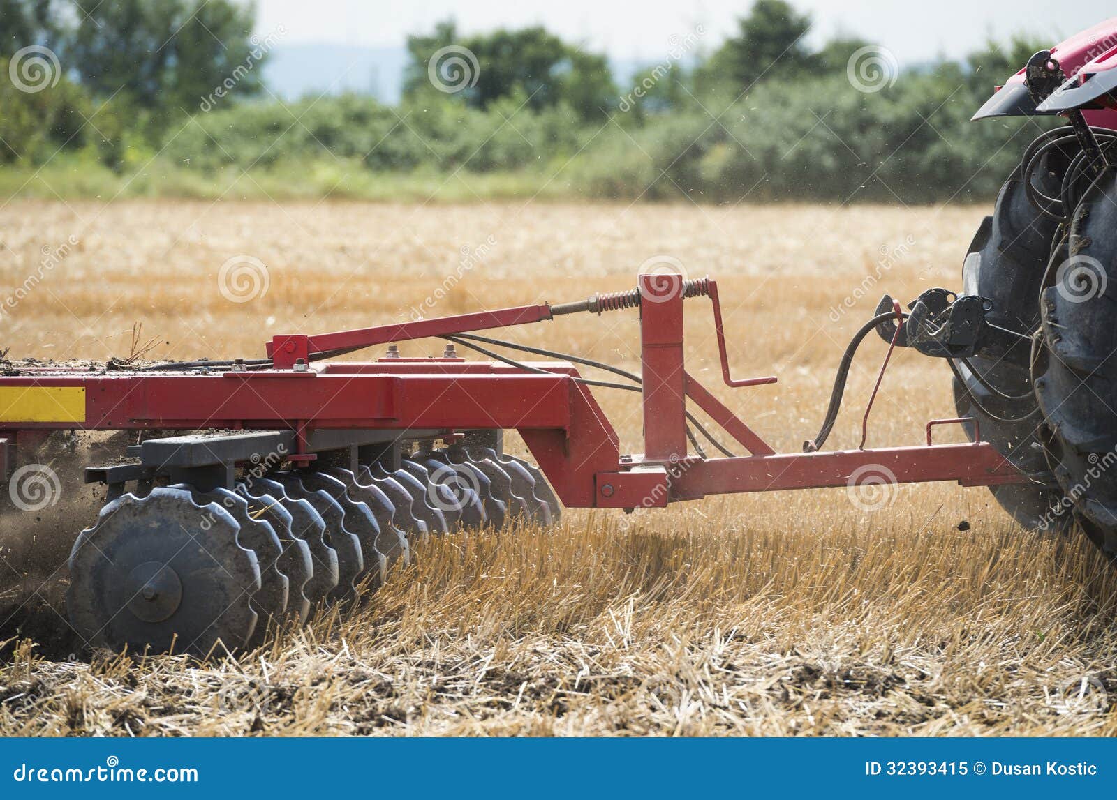 Preparation Of The Field By The Farmer By Disking The Soil On A Tractor ...