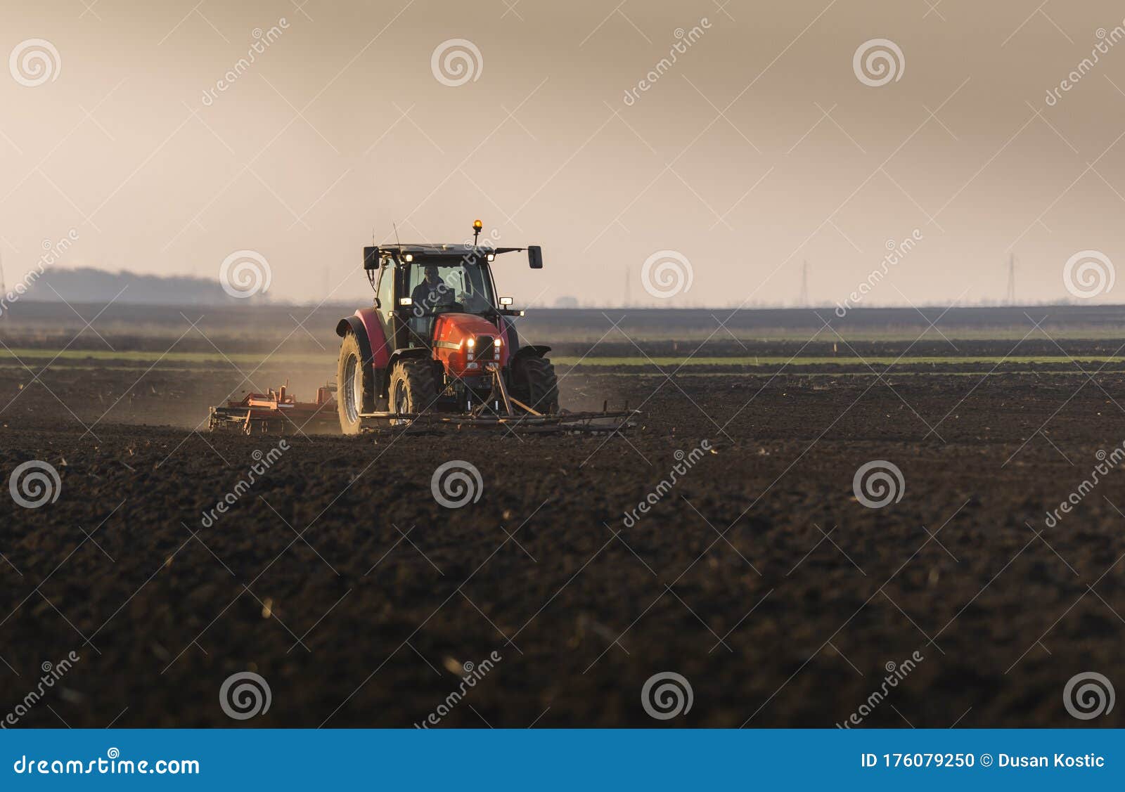Tractor is Preparing the Land at Dusk Stock Photo - Image of machinery ...