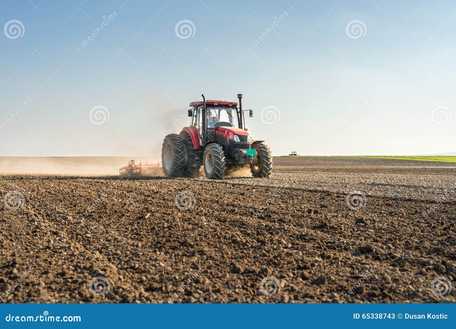 Tractor preparing land stock image. Image of machinery - 65338743