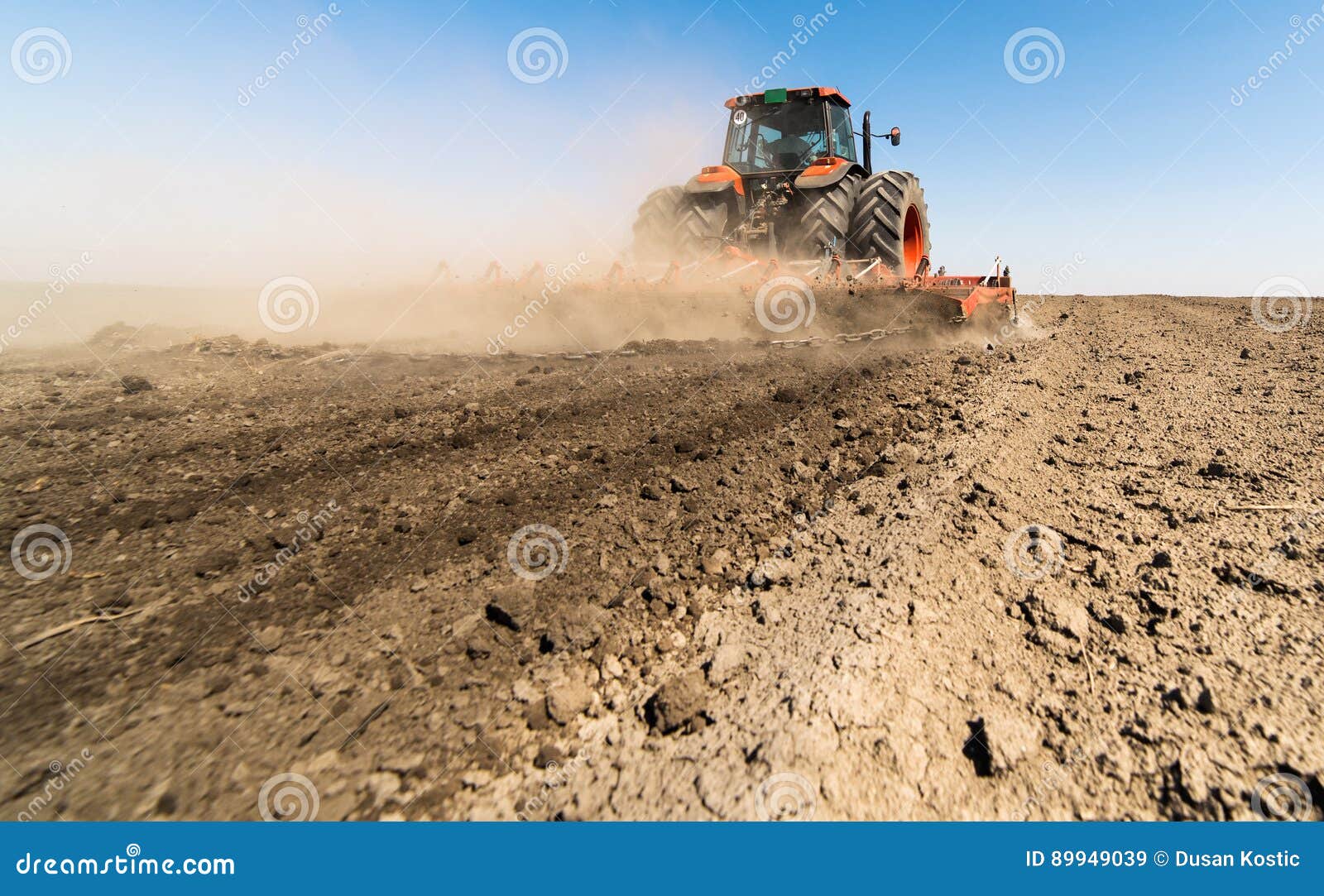 Tractor preparing land stock image. Image of landscaped - 89949039