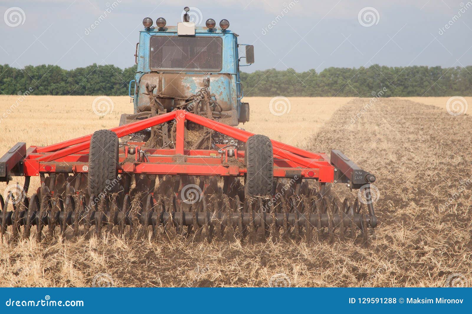 Tractor Preparing Land for Sowing Stock Photo - Image of earth, brown ...