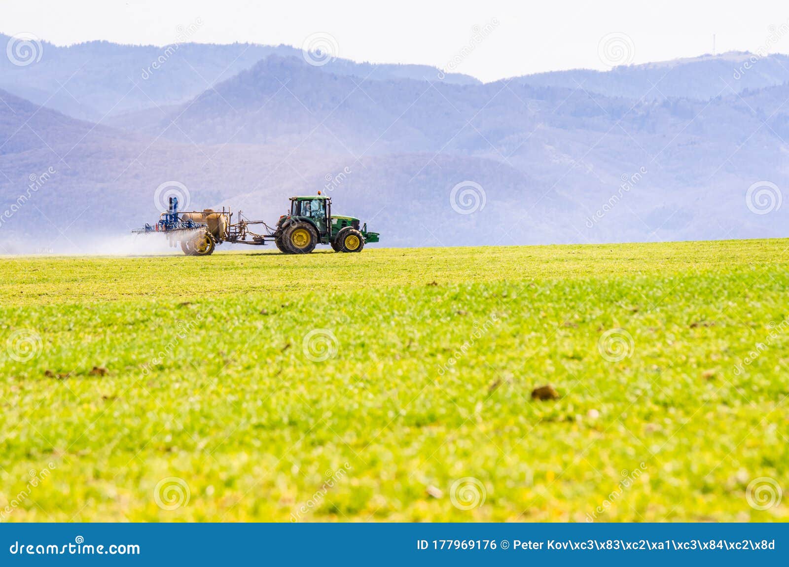 Tractor Preparing Spring Agriculture Field and Using Insecticide Which ...