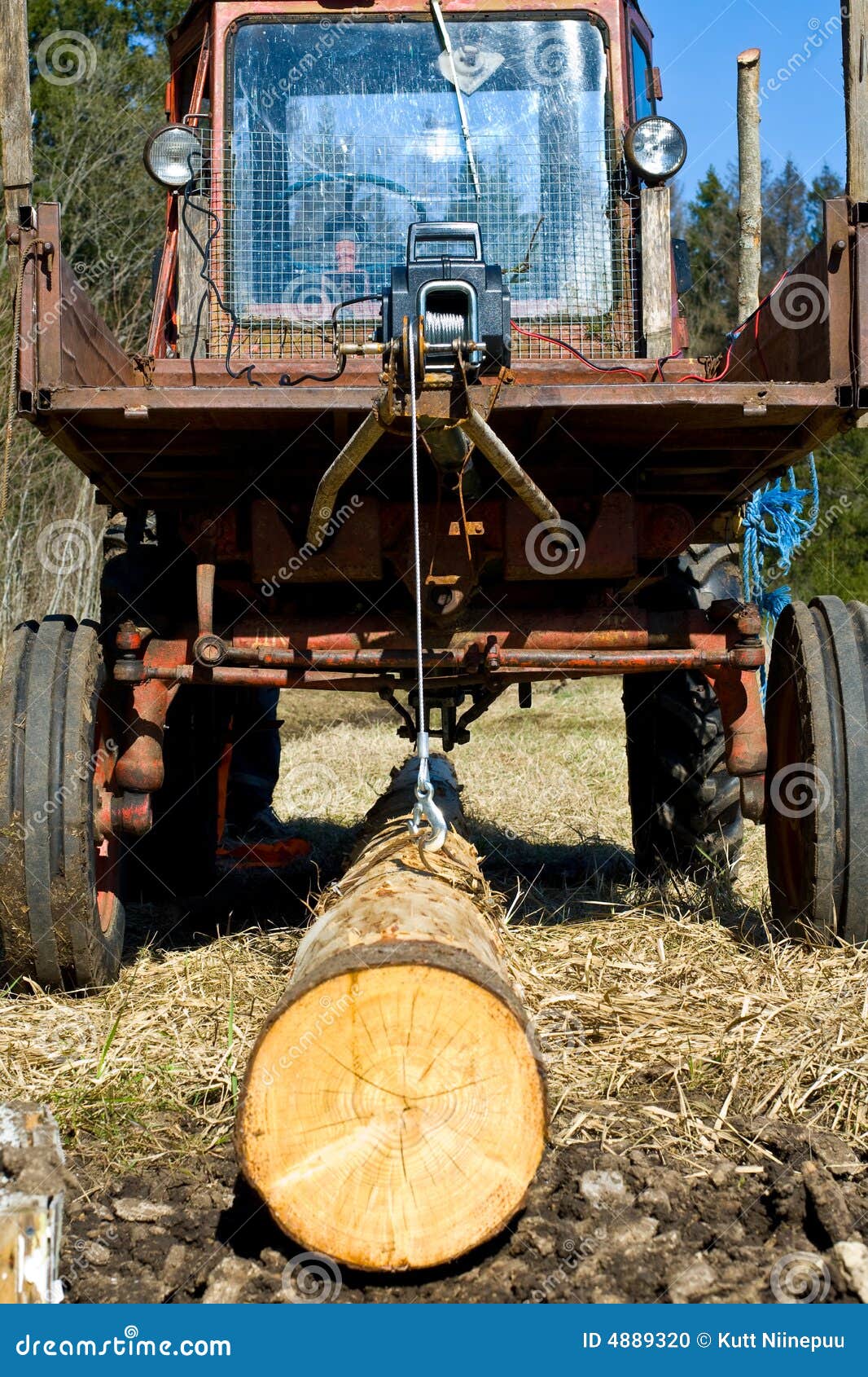 Tractor pulling a log stock photo. Image of natural, outdoor - 4889320