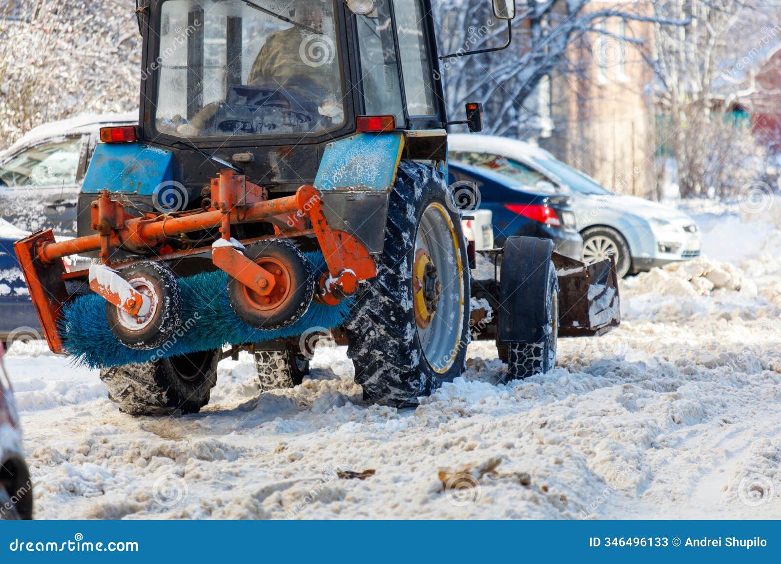 A Tractor is Pulling a Snow Plow Behind it Stock Image - Image of back ...