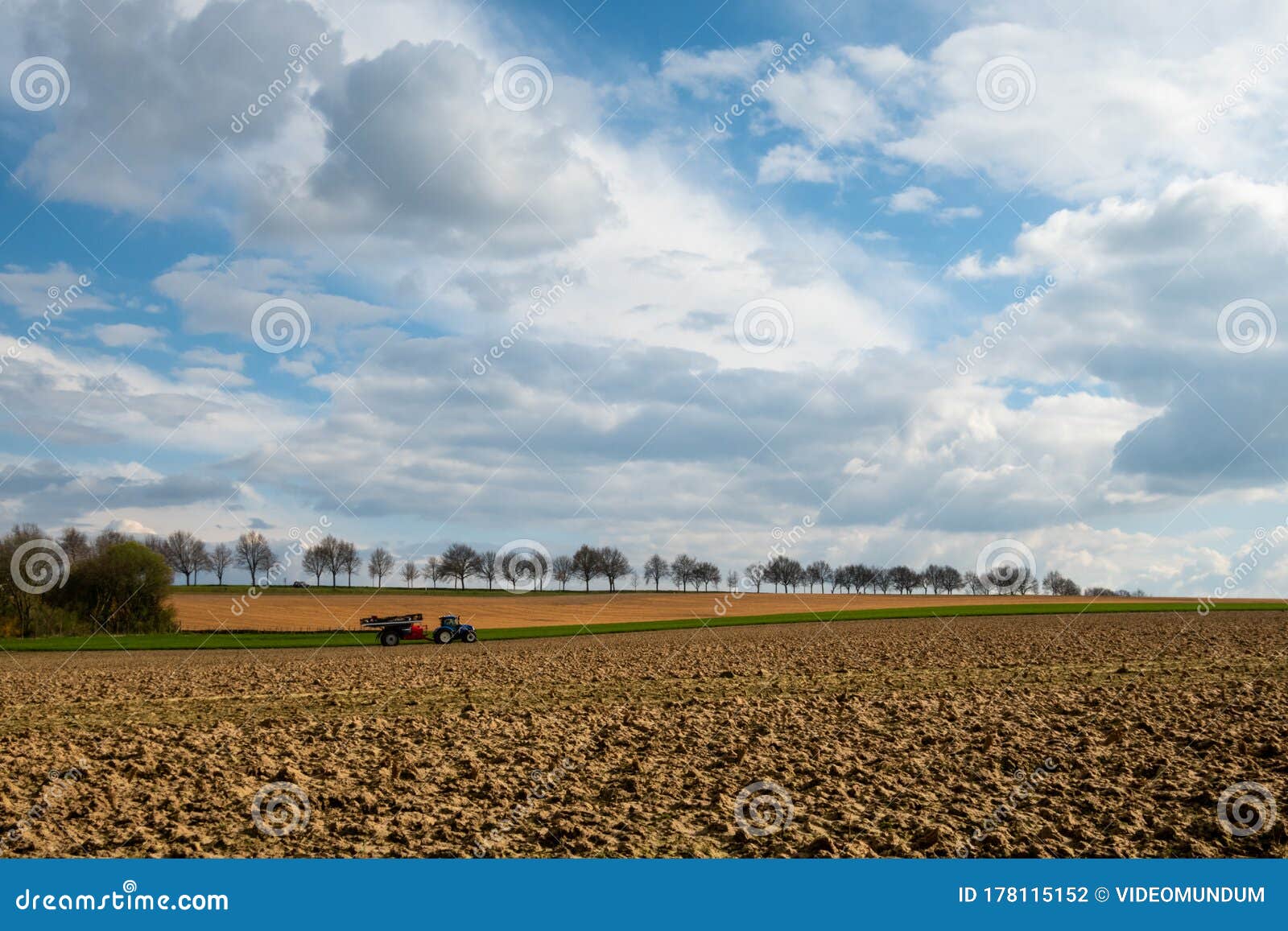 Tractor Pulling a Trailer of a Plowed Agricultural Field Stock Photo ...