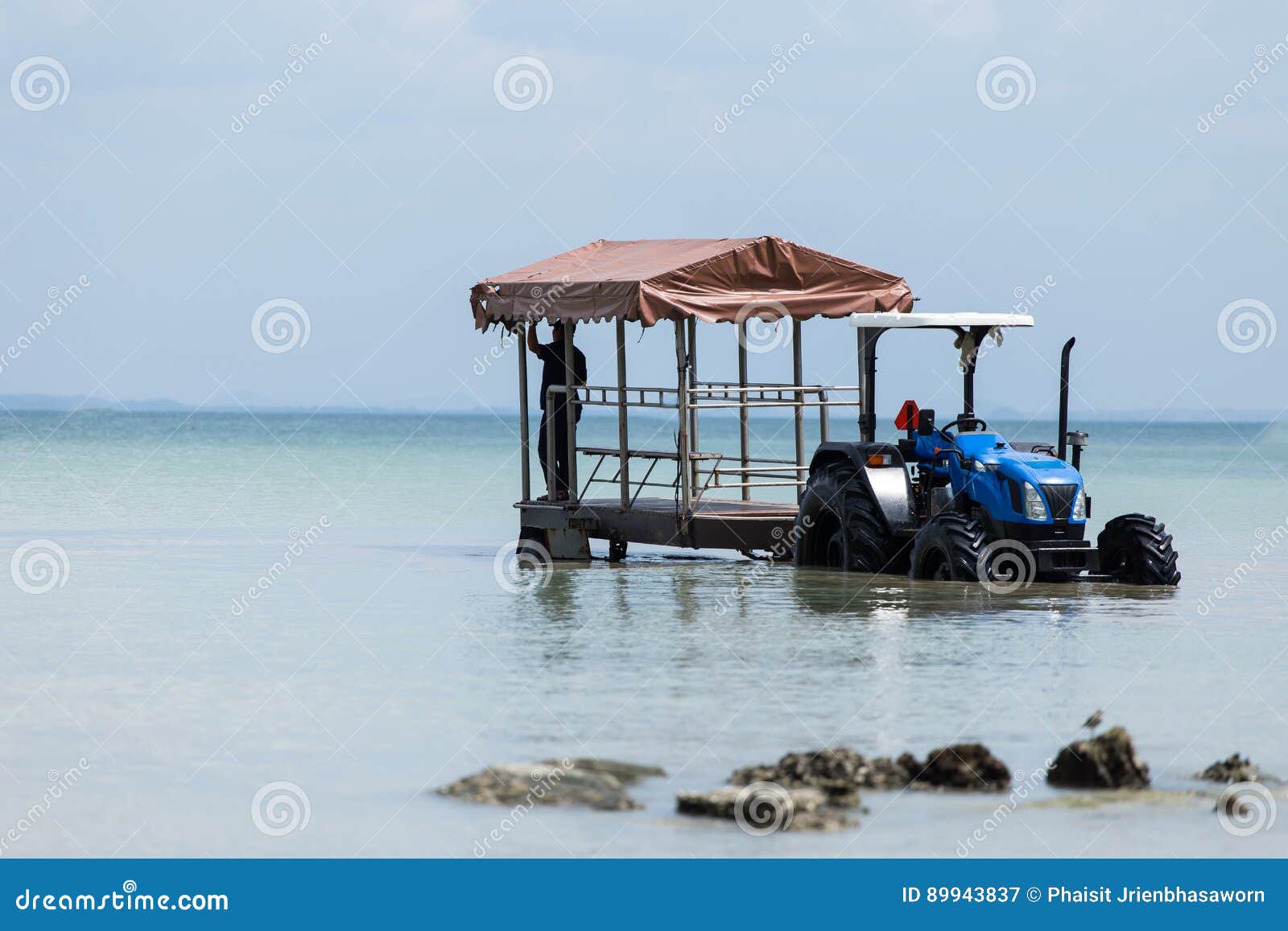 Tractor in the sea stock image. Image of wheels, machine - 89943837