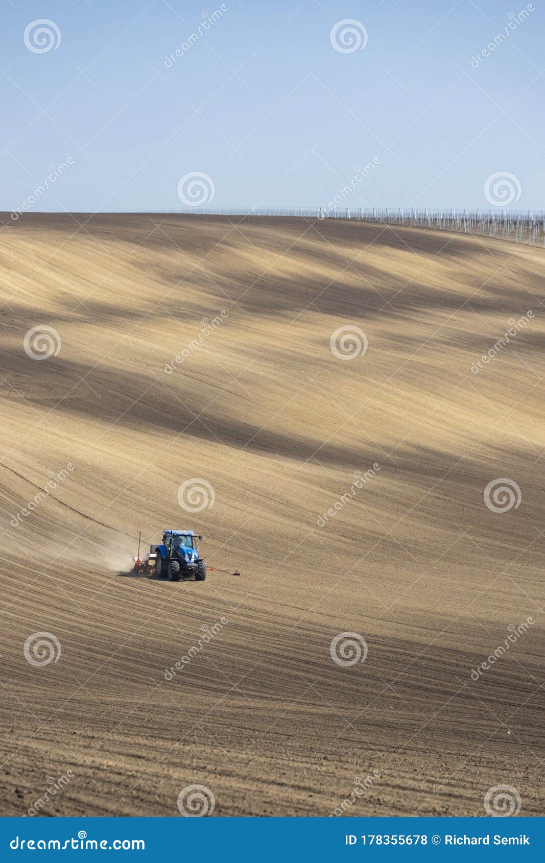 Tractor with Seed Drill in Early Spring Landscape Stock Photo - Image ...