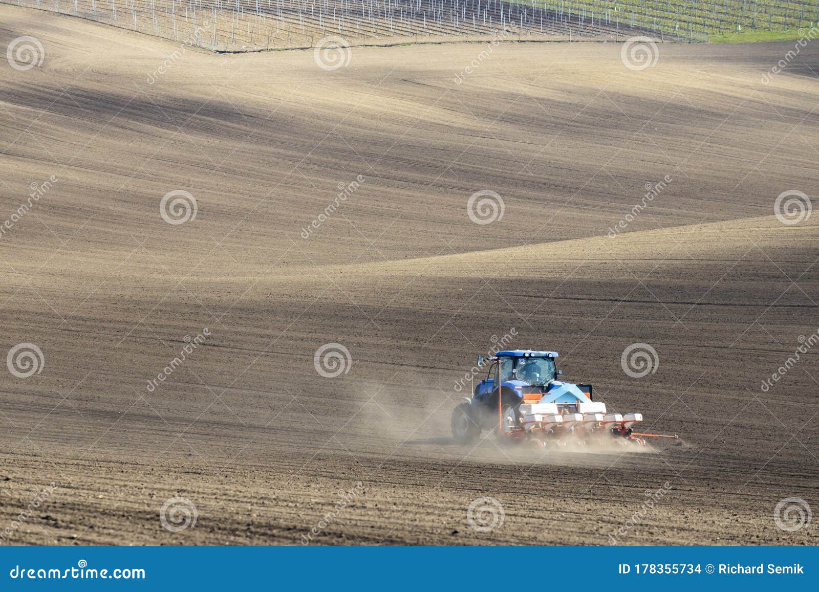 Tractor with Seed Drill in Early Spring Landscape Stock Photo - Image ...