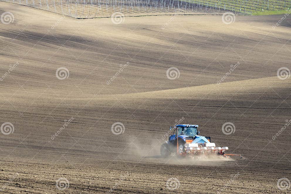 Tractor with Seed Drill in Early Spring Landscape Stock Photo - Image ...