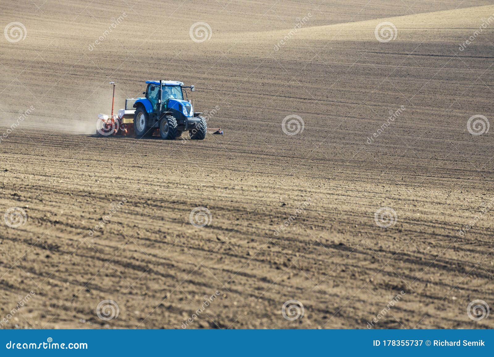 Tractor with Seed Drill in Early Spring Landscape Stock Image - Image ...