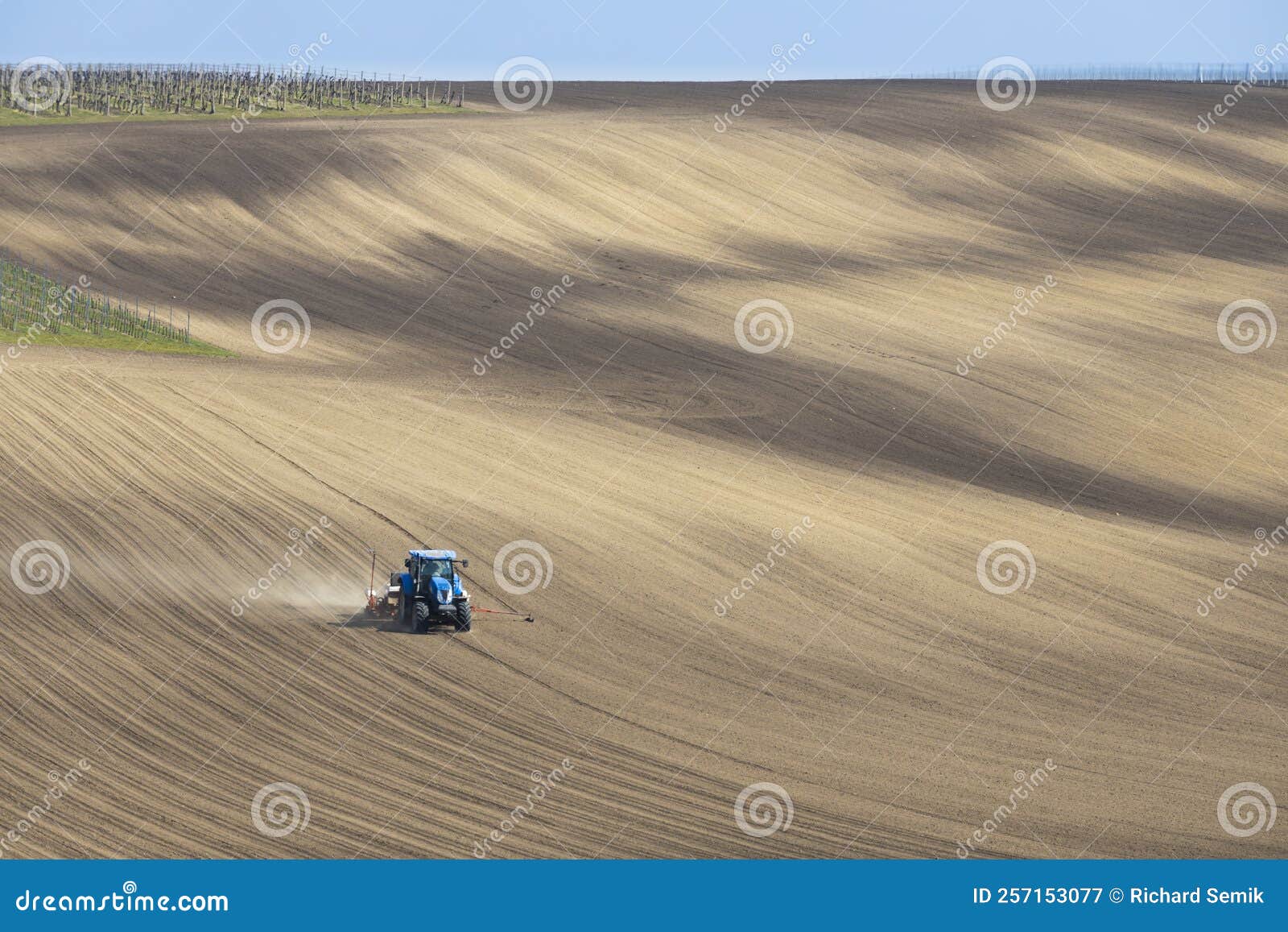 Tractor with Seed Drill in Early Spring Landscape Stock Image - Image ...