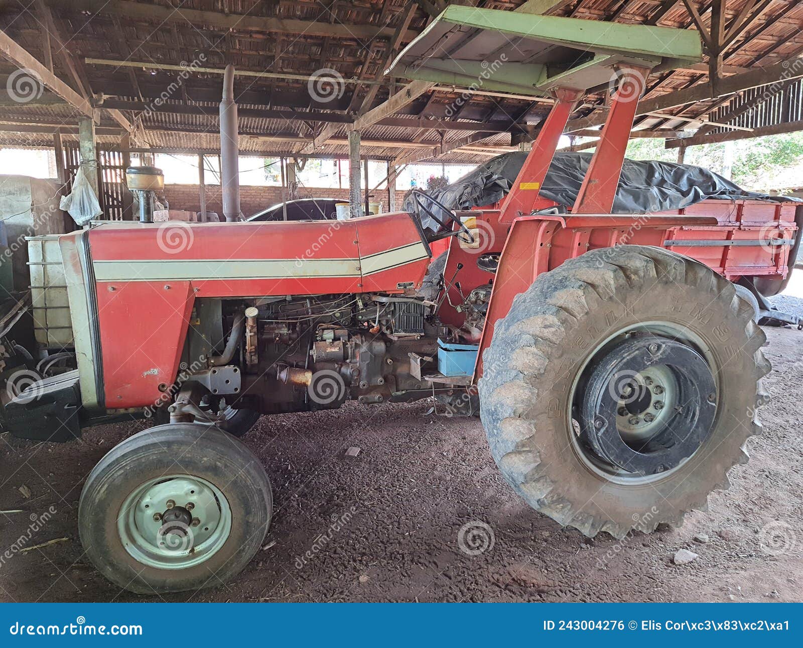 Tractor in a Shed on a Farm. Stock Photo - Image of people, farm: 243004276
