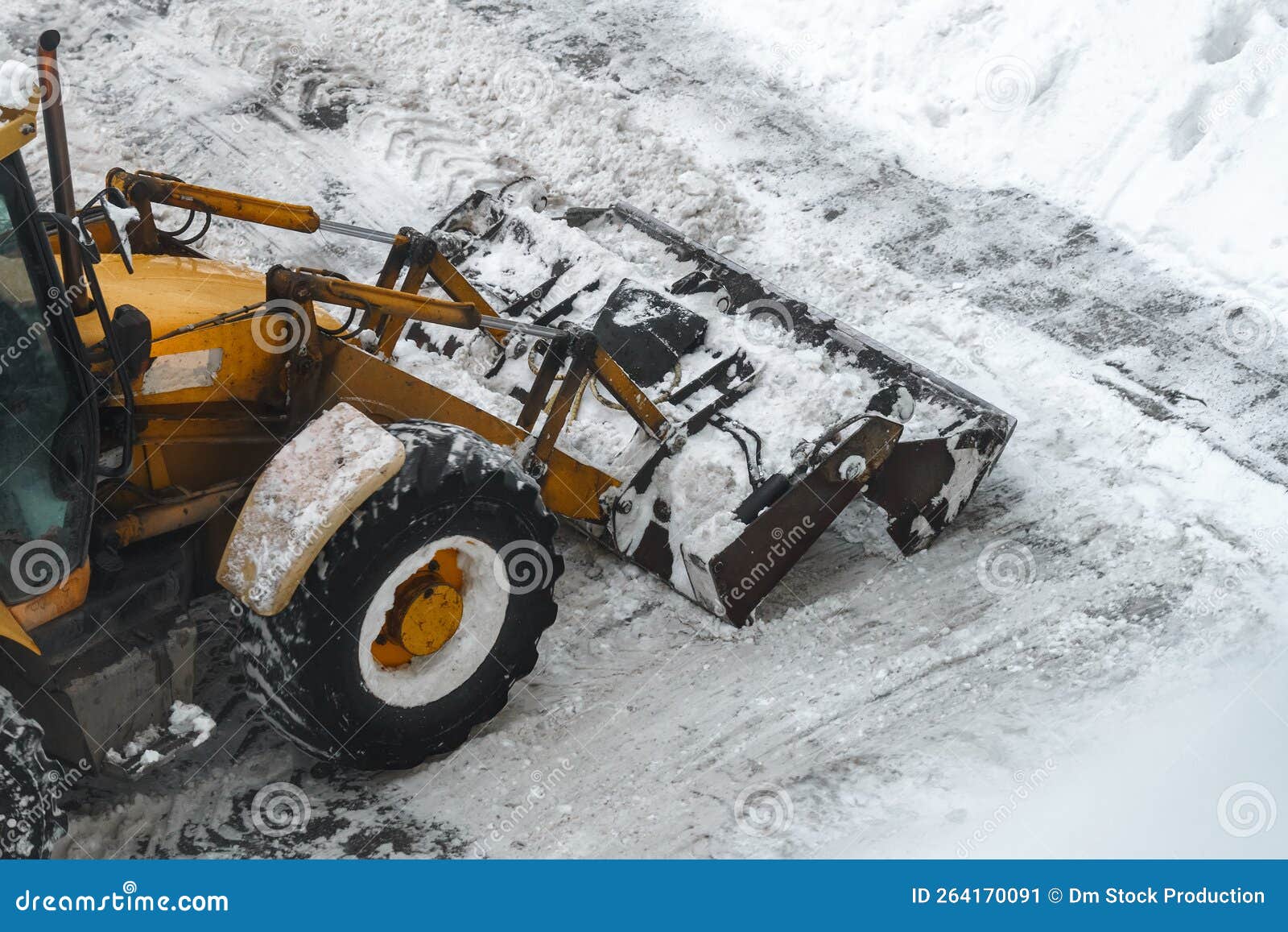 Tractor shoveling snow stock image. Image of equipment - 264170091