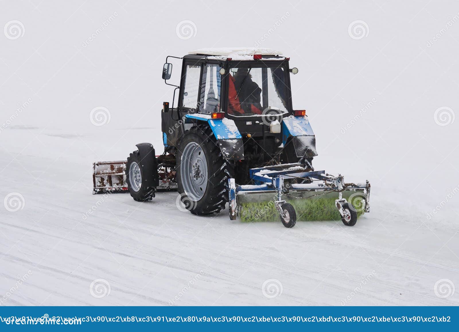 Tractor with a Snow Plow and a Mechanical Sweeper Moves on a Snowy ...