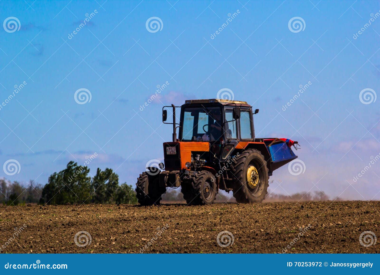 Tractor Spaying a Field in the Spring Editorial Photography - Image of ...