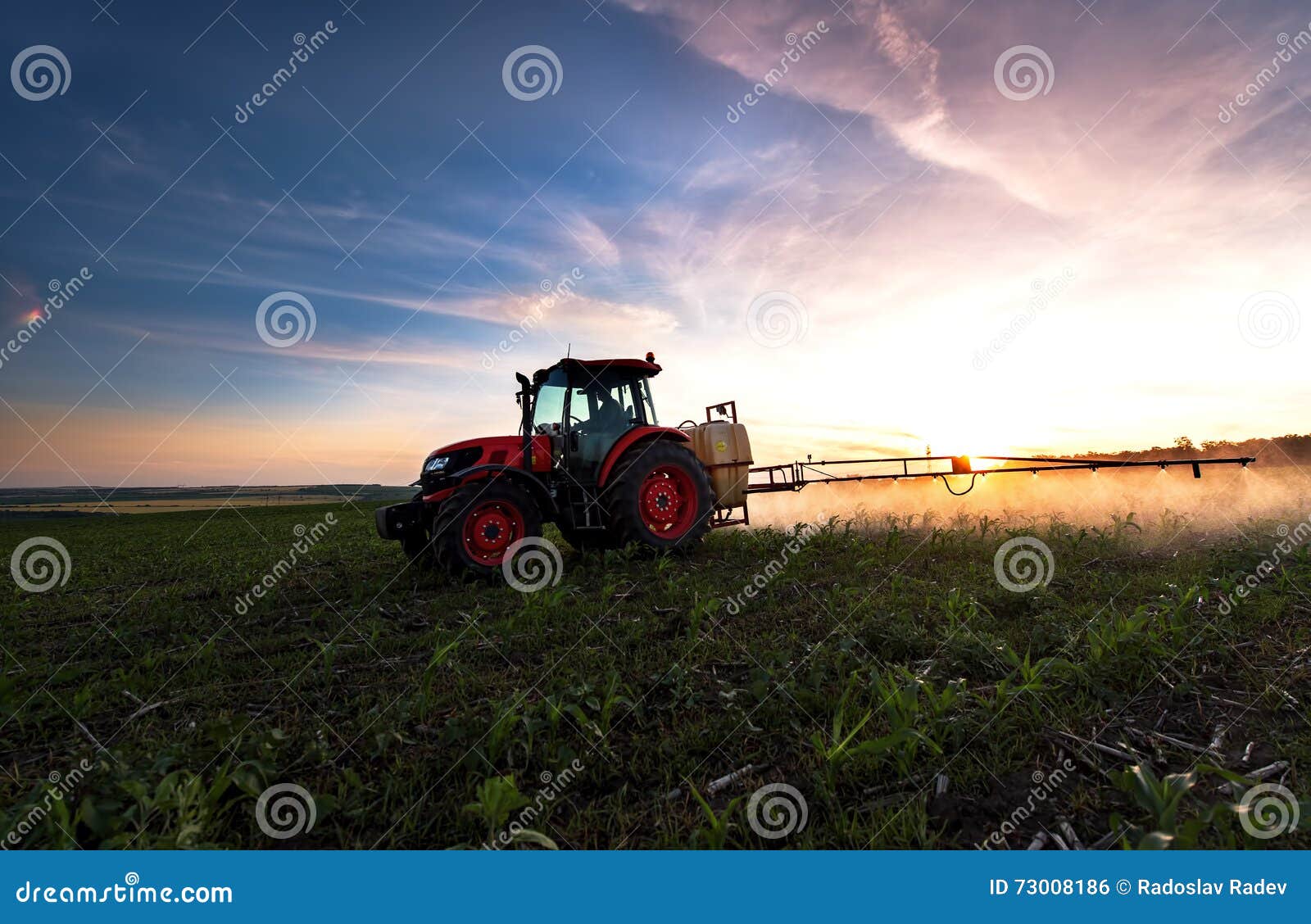 Tractor Spraying a Field on Farm in Spring. Editorial Photo - Image of ...