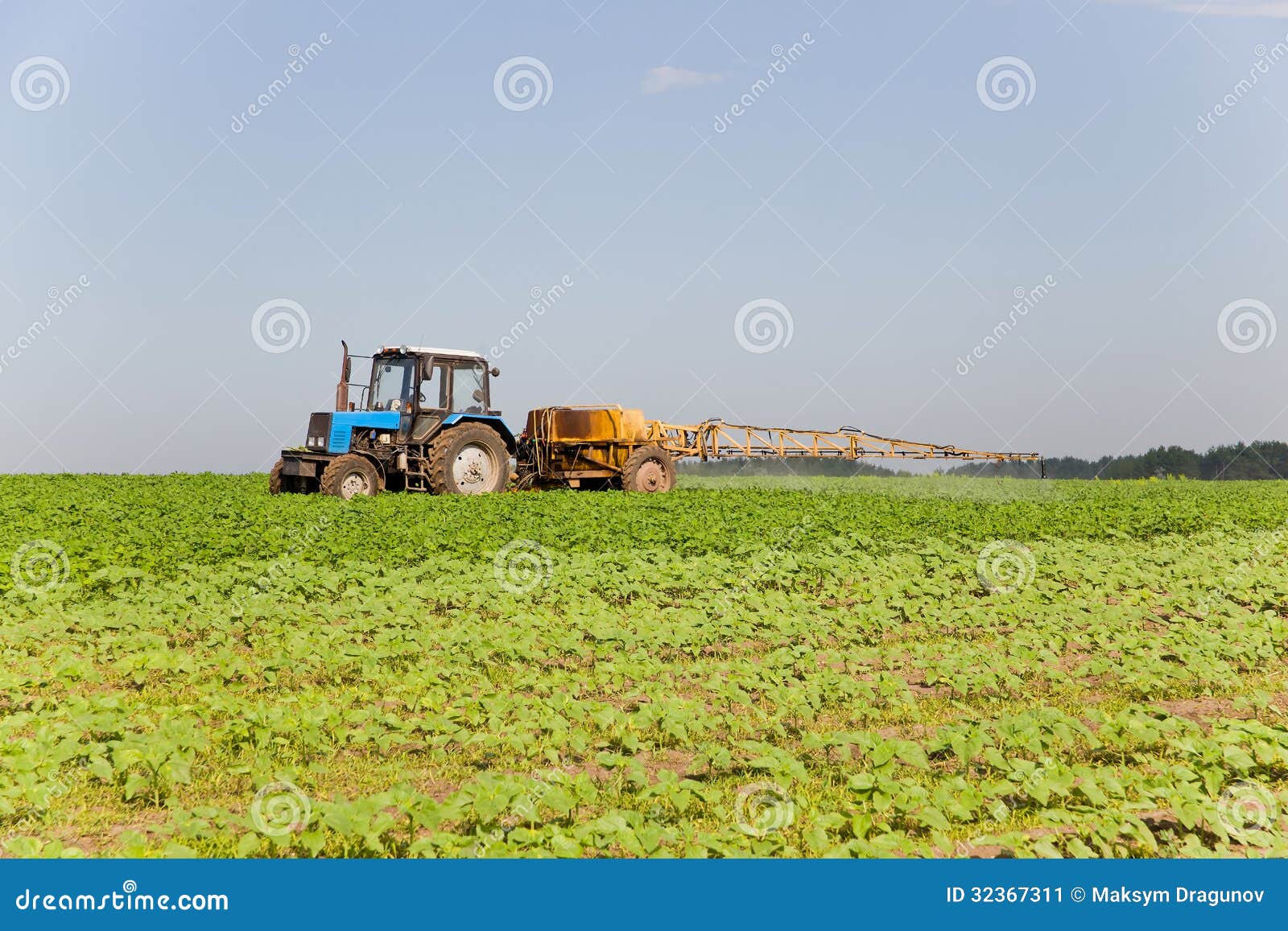 Tractor spraying the field stock image. Image of cultivation - 32367311