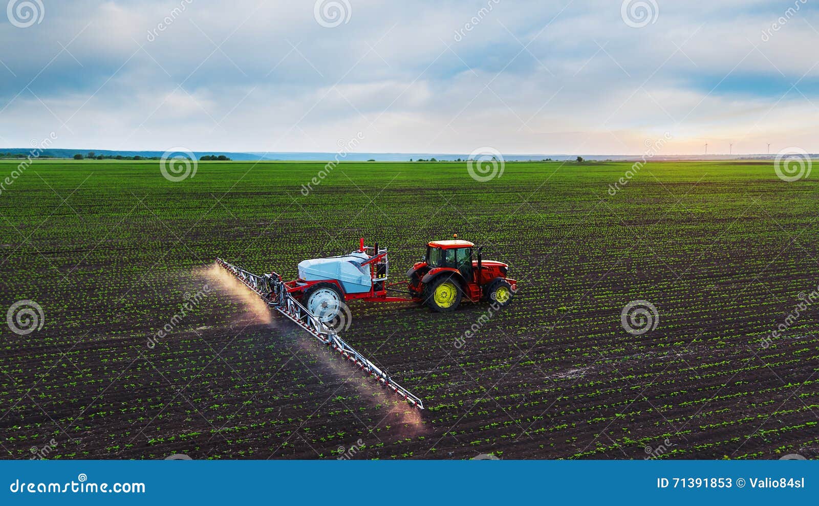 Tractor Spraying Field at Spring Stock Image - Image of plant, farmer ...