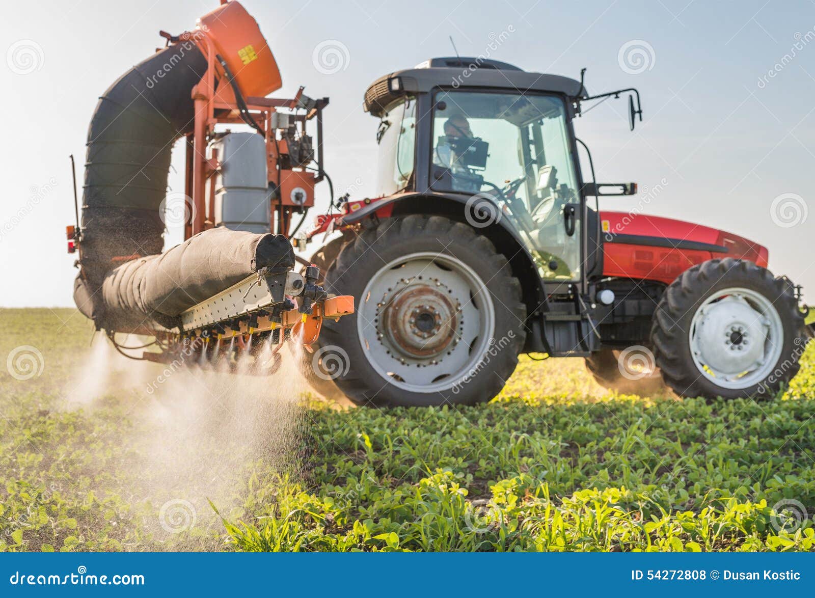 Tractor Spraying Pesticides Stock Photo - Image of cultivated, field ...