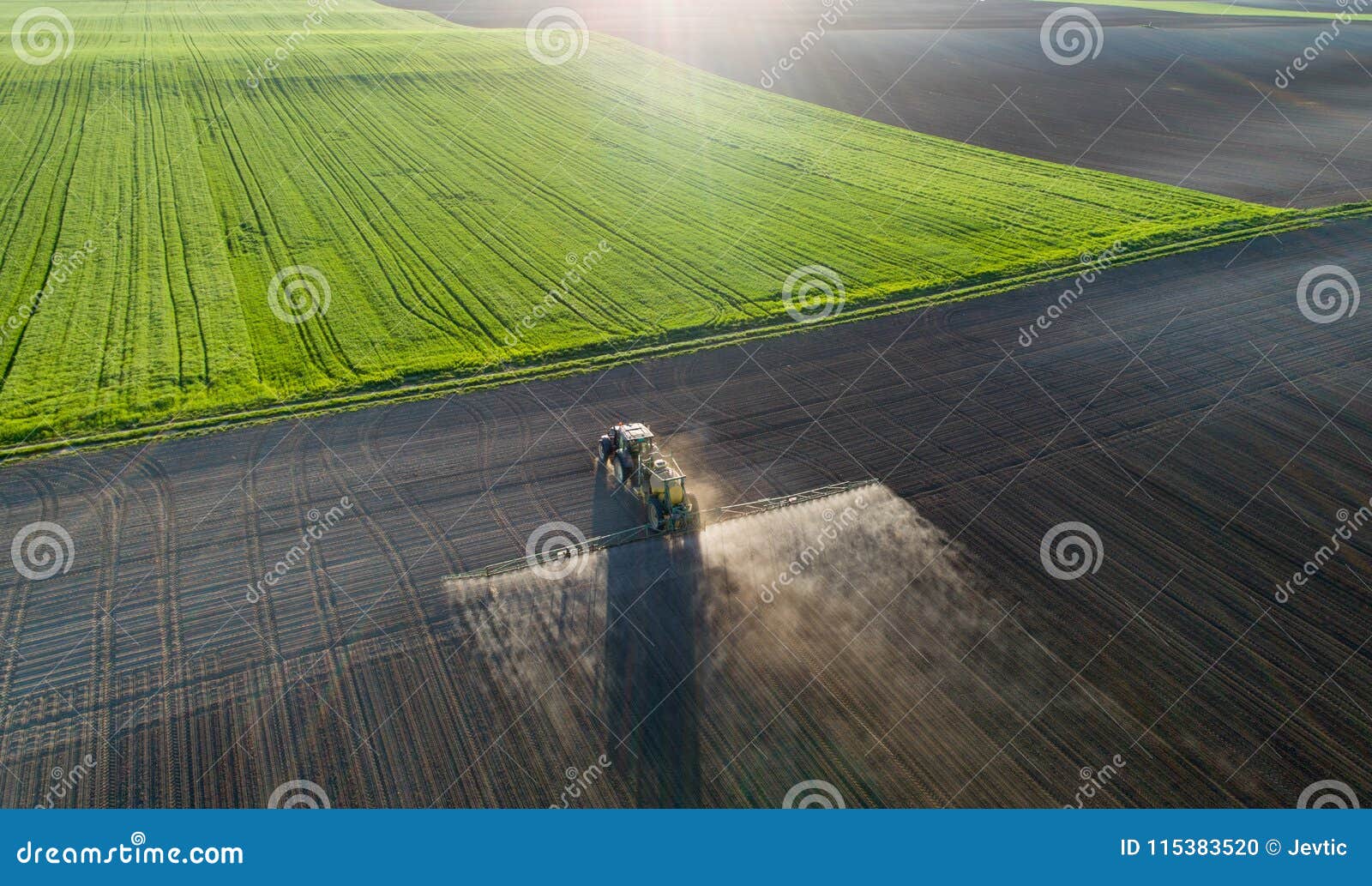 Tractor Spraying Soil in Field Stock Photo - Image of equipment ...