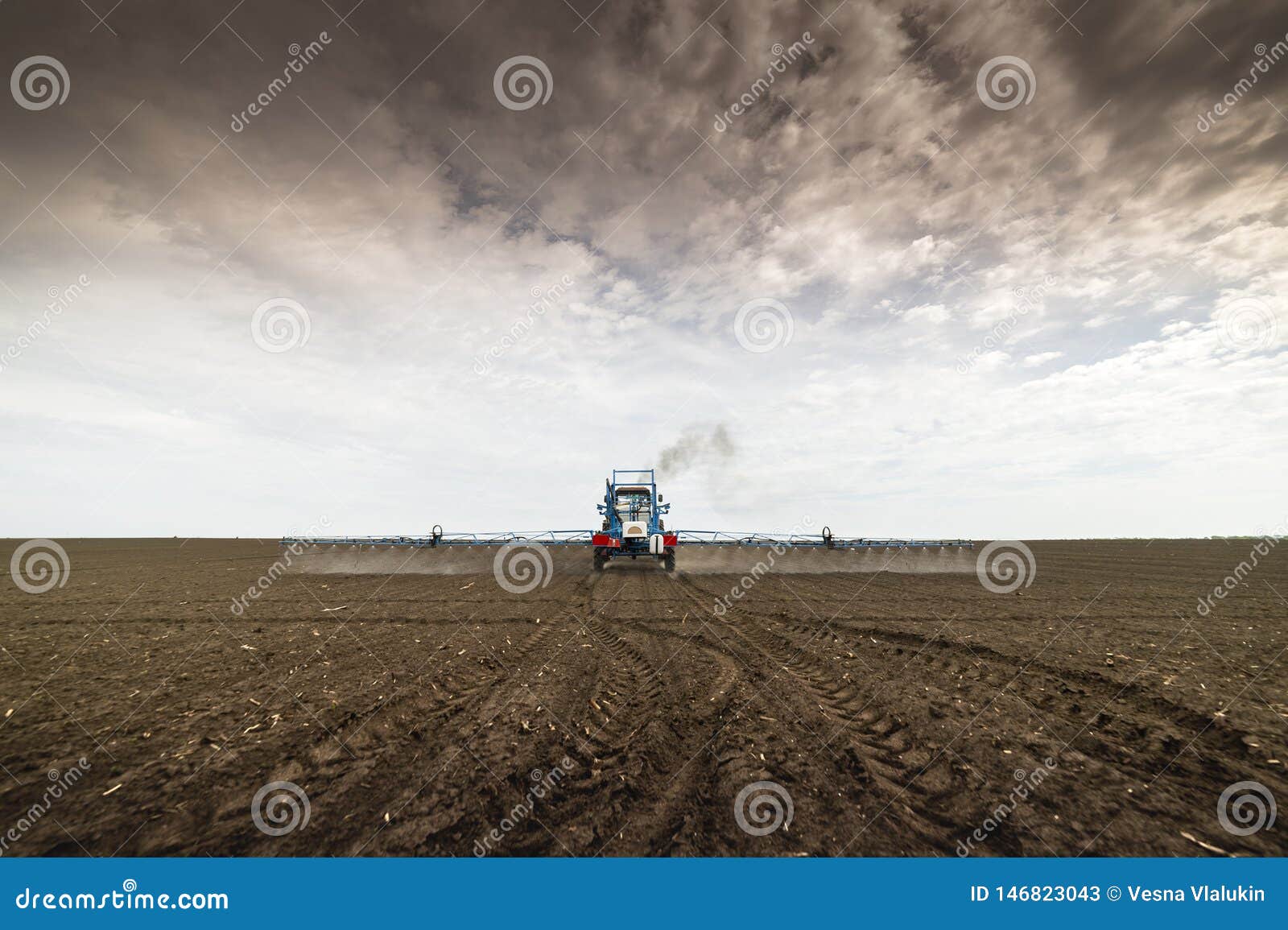 Tractor Spraying Soil in Field Stock Image - Image of rural, equipment ...