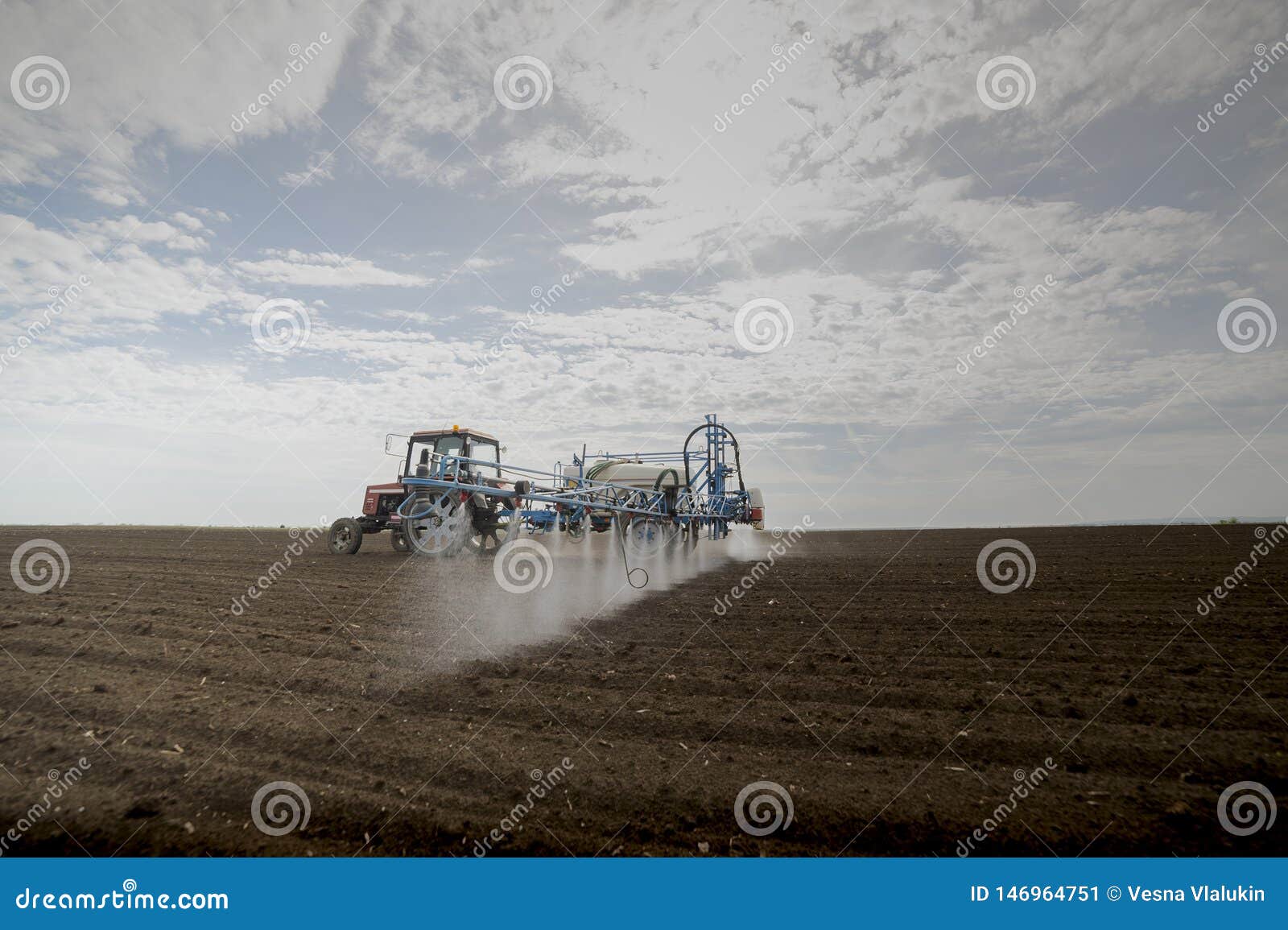 Tractor Spraying Soil in Field Stock Image - Image of ground, field ...