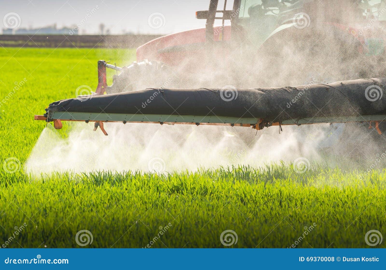 Tractor Spraying Wheat Field Stock Photo - Image of scene, tractor ...