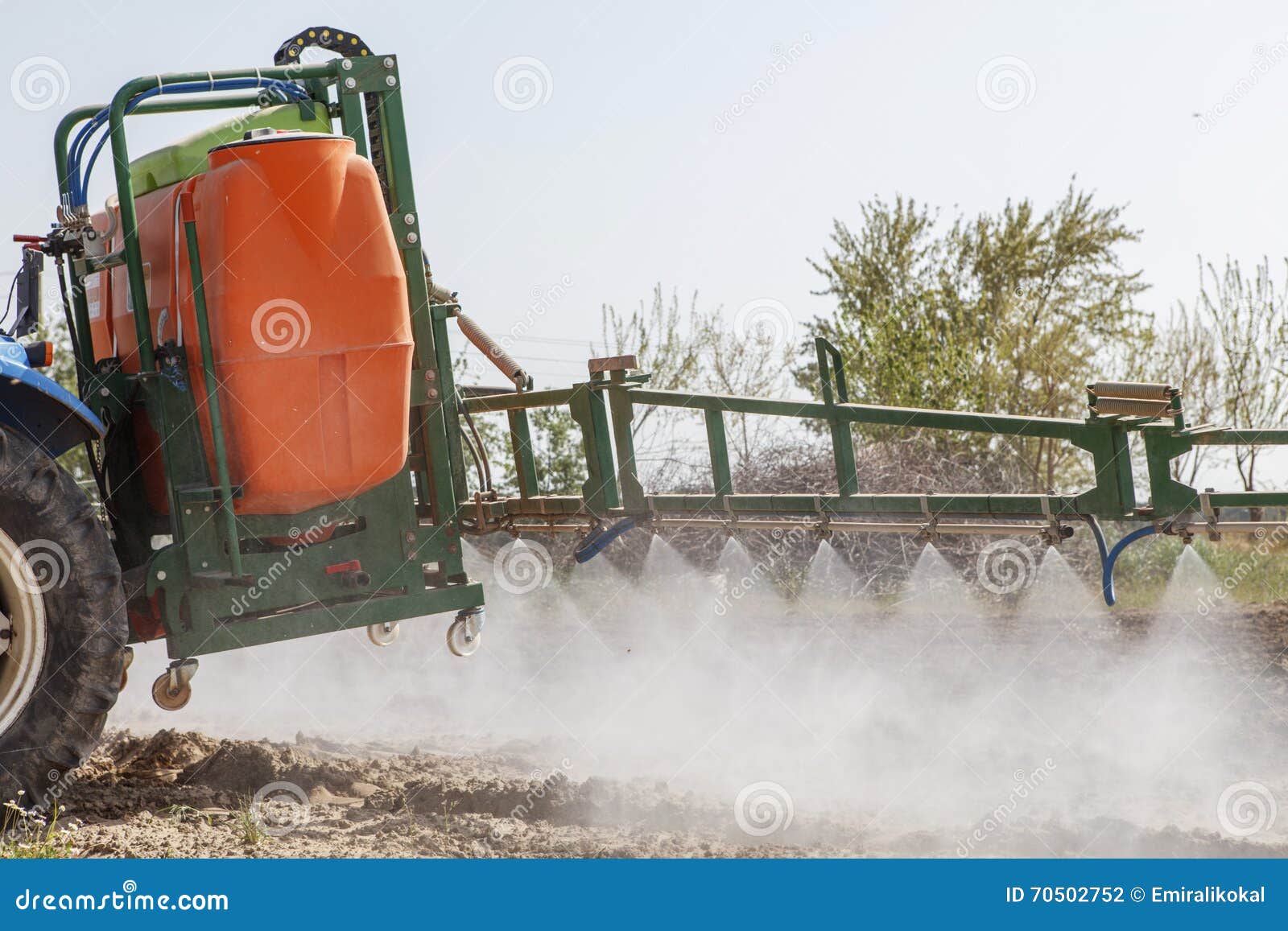 Tractor Spraying Wheat Field Stock Photo - Image of rural, tractor ...
