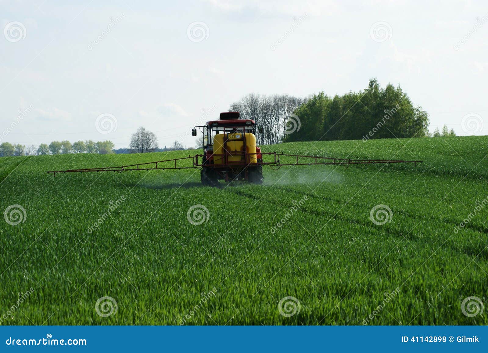 Tractor spraying wheat v3 stock photo. Image of tracks - 41142898