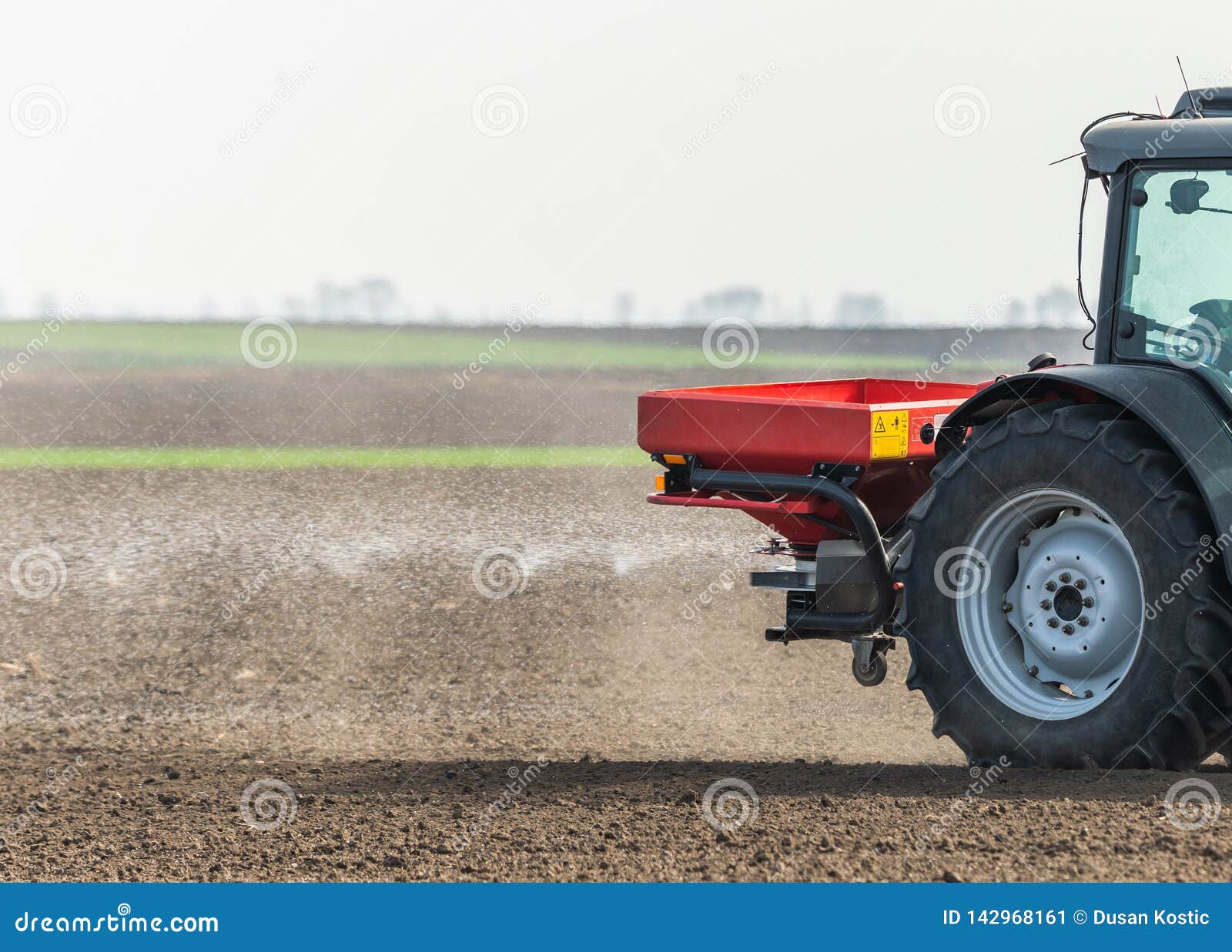 Tractor Spreading Artificial Fertilizers in Field Stock Image - Image ...
