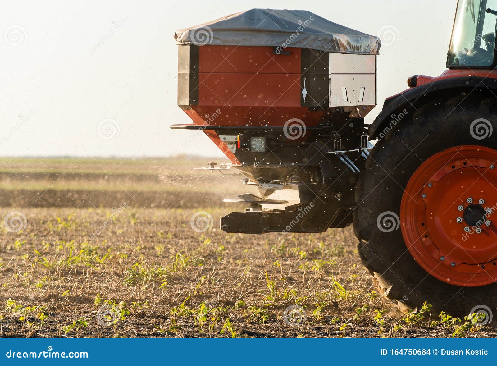 Tractor Spreading Artificial Fertilizers Stock Photo - Image of spray ...