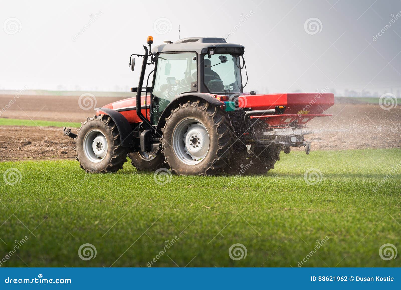 Tractor Spreading Artificial Fertilizers Stock Photo - Image of ...