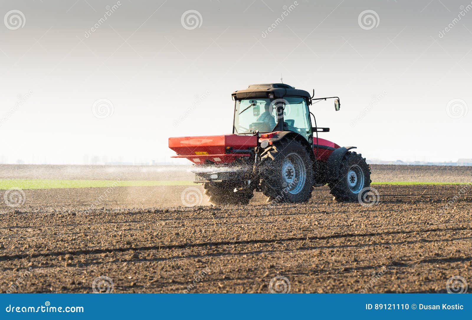 Tractor Spreading Artificial Fertilizers Stock Photo - Image of ...