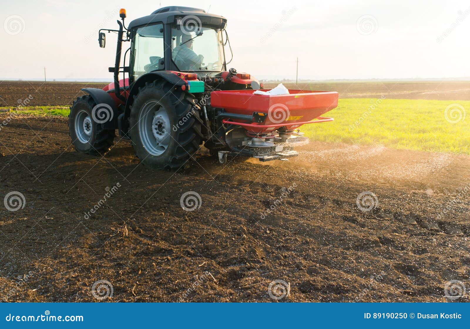 Tractor Spreading Artificial Fertilizers Stock Photo - Image of ...