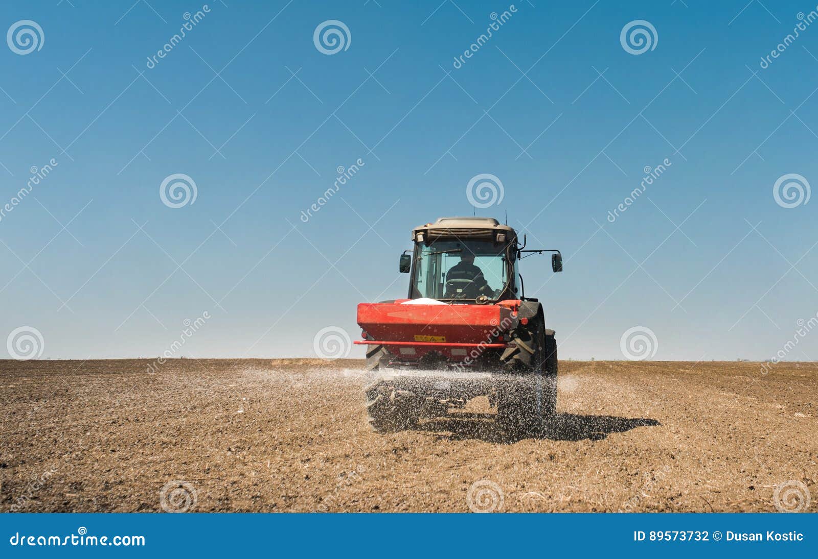 Tractor Spreading Artificial Fertilizers Stock Photo - Image of spray ...