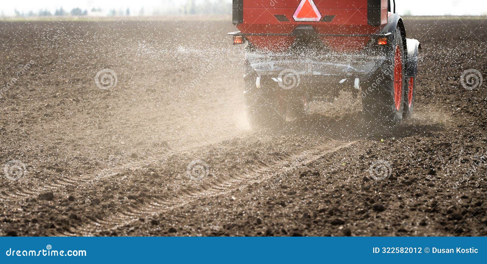 Tractor Spreading Artificial Fertilizers Stock Photo - Image of spread ...