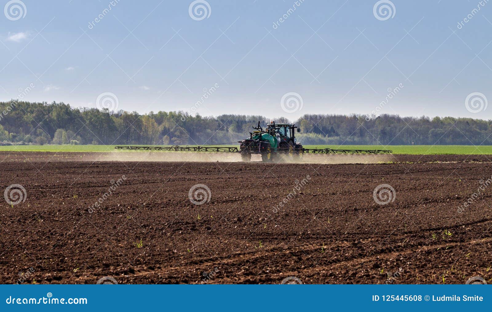 Tractor on plowed land. editorial stock photo. Image of countryside ...