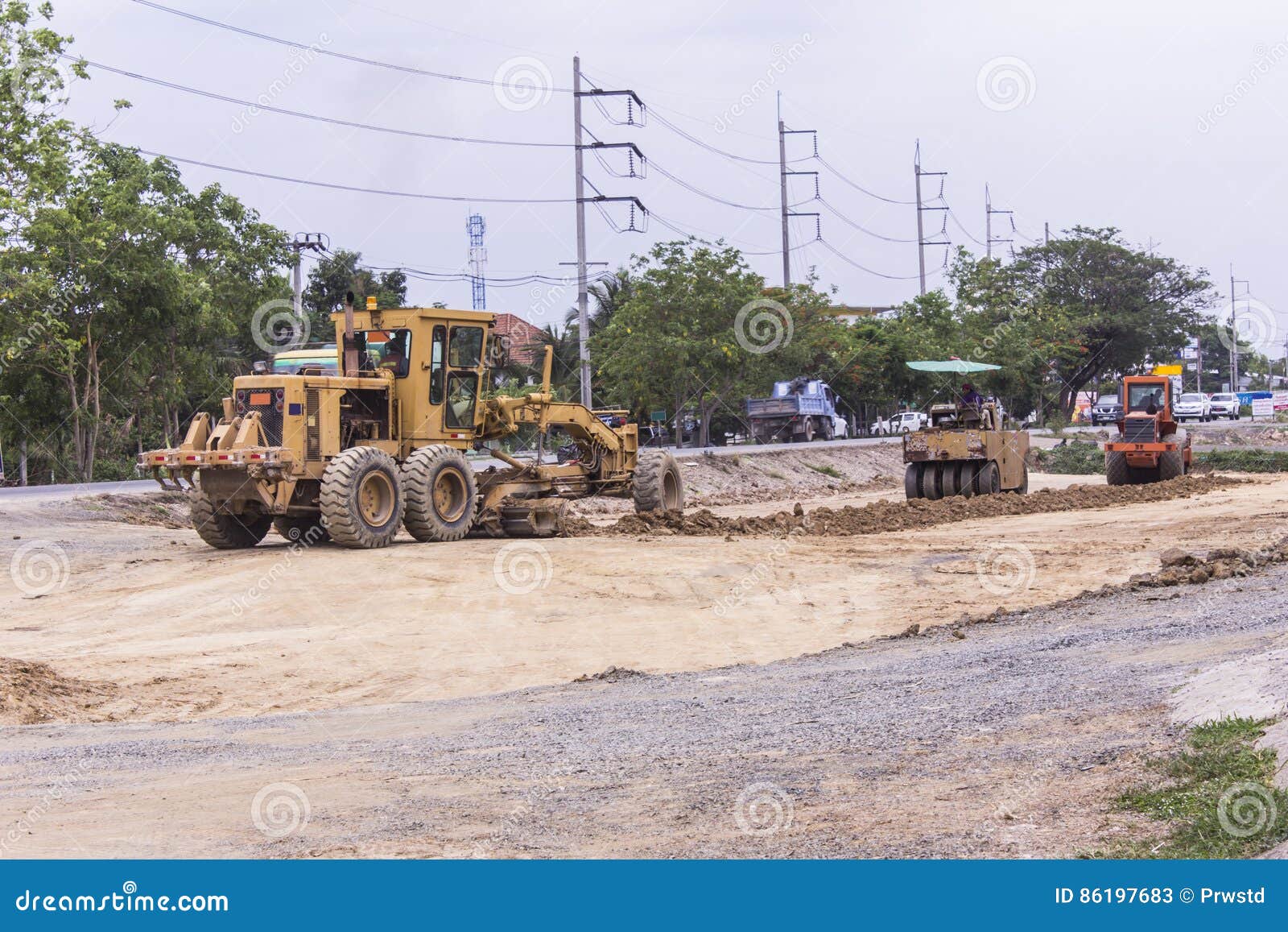 Steamroller And Road Construction Workers At Road Construction Site ...