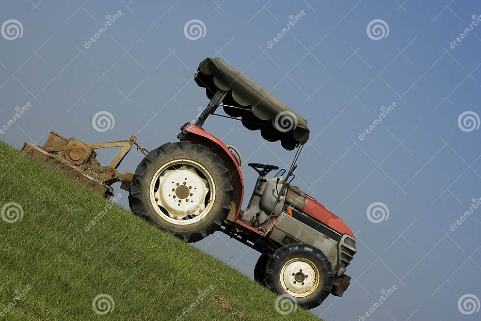 Tractor on a steep slope stock image. Image of danger - 9319195