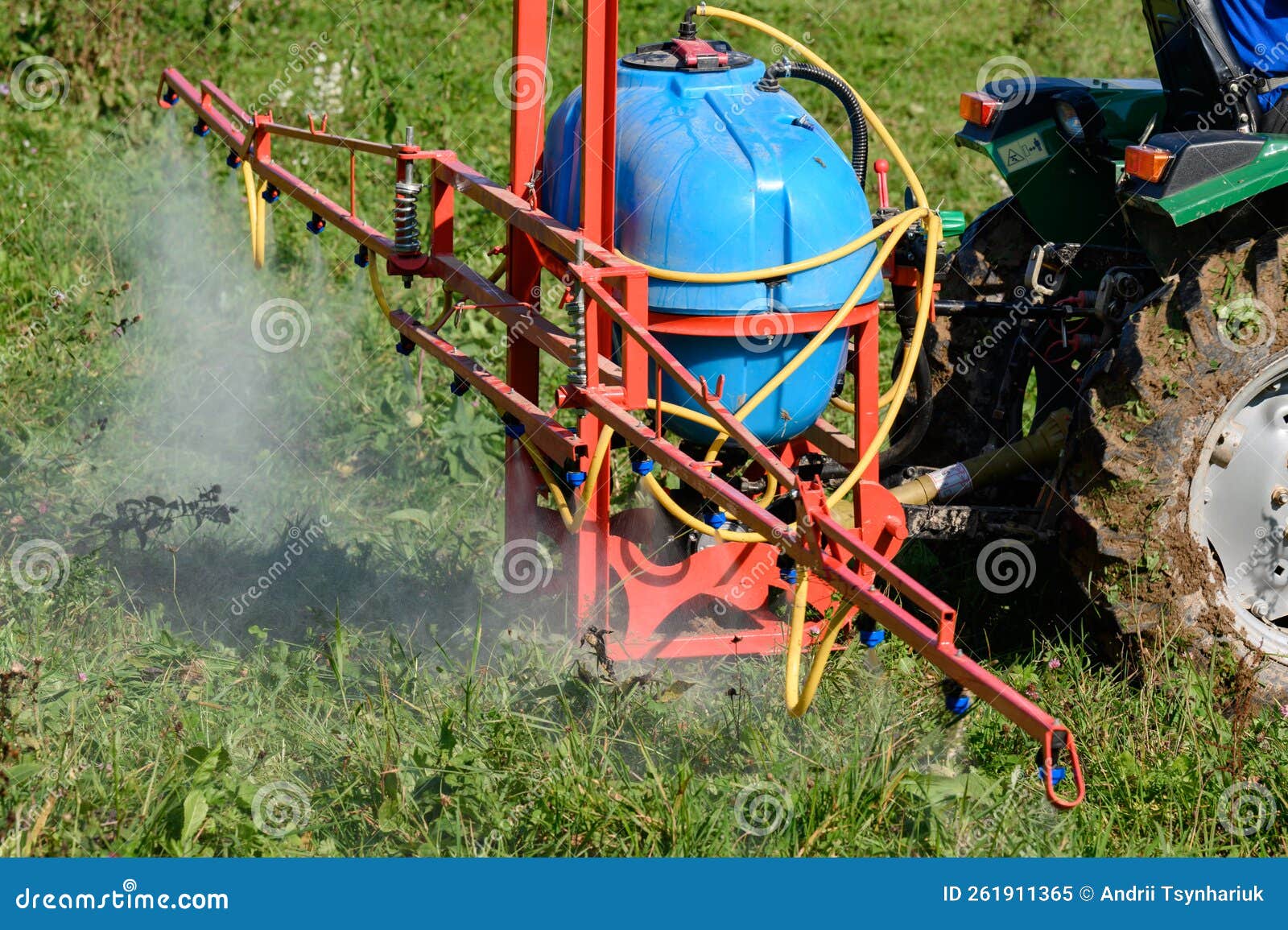 A Tractor with a Tank and Attached Equipment for Spraying the Field ...