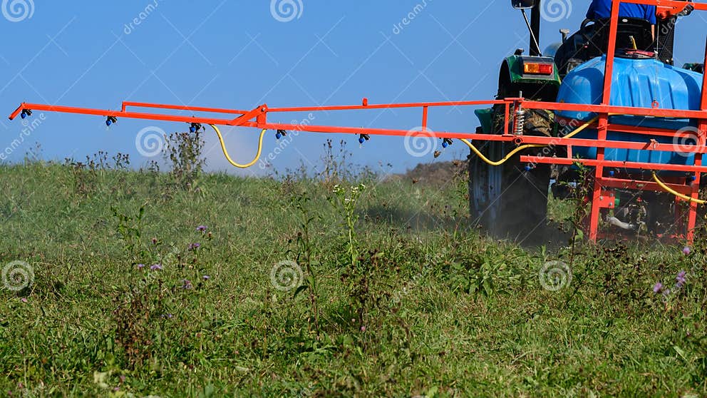 A Tractor with a Tank and Attached Equipment for Spraying the Field ...