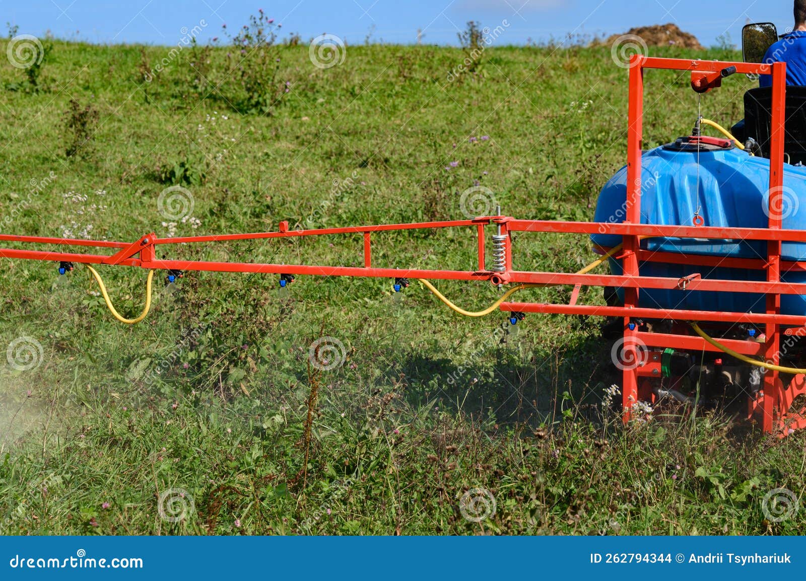 A Tractor with a Tank and Attached Equipment for Spraying the Field ...