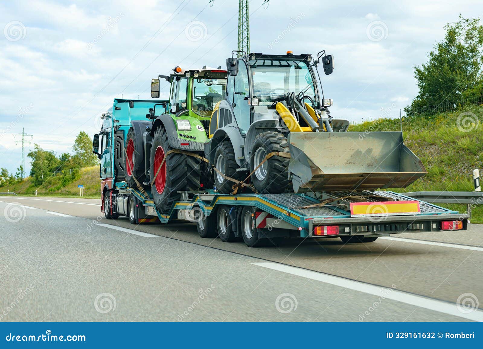 Tractor on a Tow Truck for Transportation by Road Stock Photo - Image ...