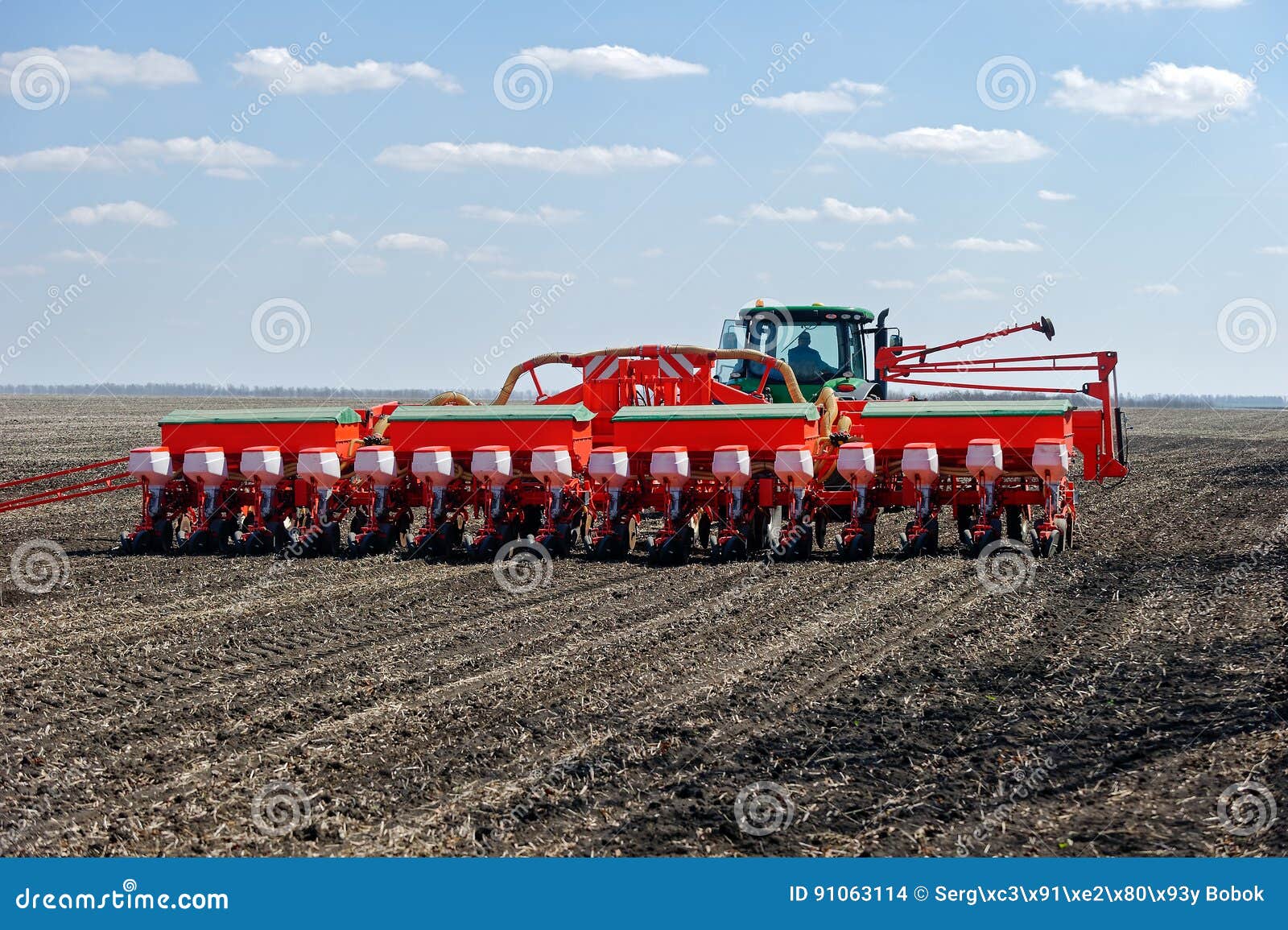 Tractor with Trailed Planter on the Field Stock Photo - Image of ...